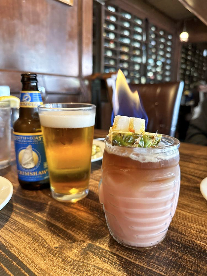 Nothing says "vacation mode activated" quite like a craft beer and a cocktail with actual flames. Fire and alcohol—what could possibly go wrong?