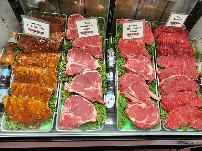 The meat case—where your dinner begins its journey. Like a Renaissance painting, but with more protein.