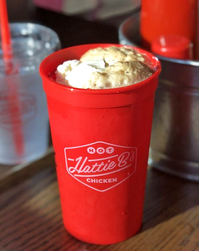 That's not just a milkshake—it's your mouth's fire extinguisher after "Damn Hot!!" chicken. The cup's red color serves as both branding and warning.