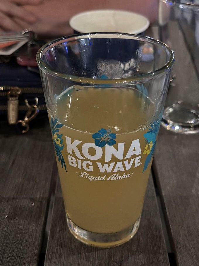 Kona Big Wave in hand, troubles dissolve. Sometimes paradise is just a golden glass of "Liquid Aloha" away.
