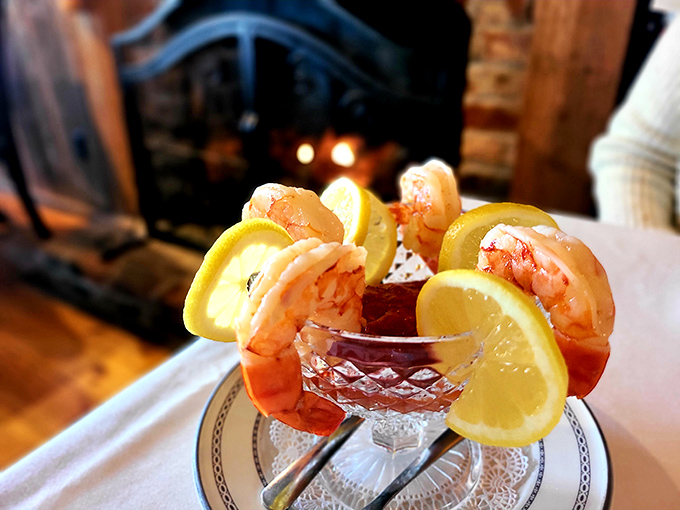Shrimp cocktail that's dressed better than most people at the Oscars – perched on crystal with lemon slices like a seafood crown jewel.