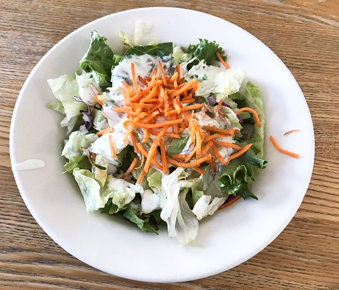 A side salad that somehow makes vegetables exciting – proof that even the supporting actors at Bake n Broil deserve standing ovations.