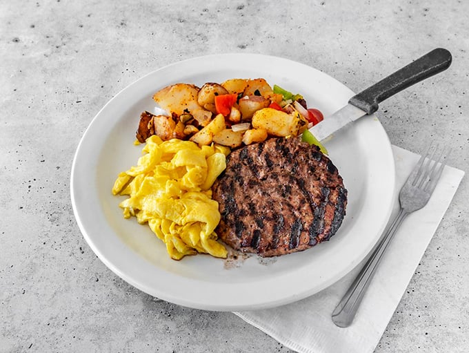 This sirloin steak, eggs, and home fries combo isn't just breakfast—it's fuel for conquering the world, or at least your Tuesday.