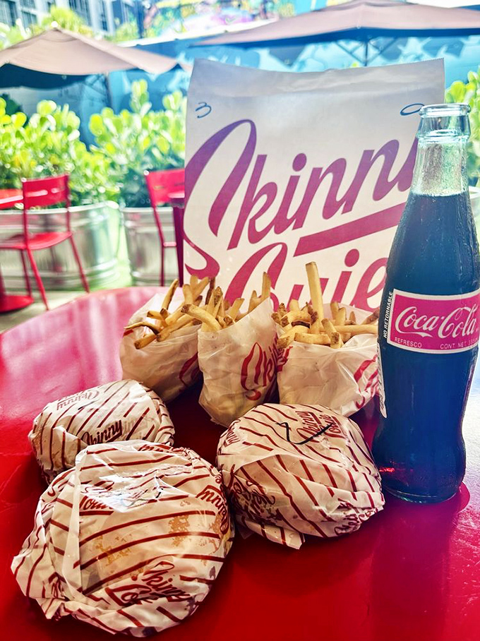 Sunshine, red tables, and smash burgers—a Miami trifecta that proves paradise isn't always about beaches and palm trees.