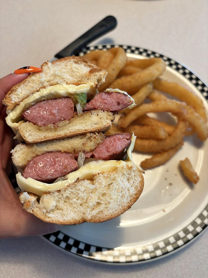 This sandwich isn't messing around – layers of smoked sausage nestled between toast with the confidence of something that knows exactly how good it is.