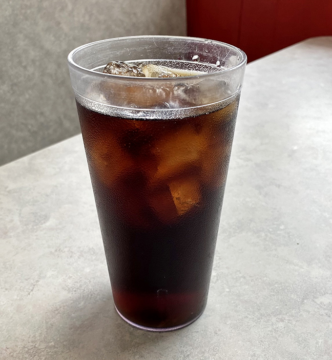 In a world of complicated craft beverages, there's something profoundly satisfying about an ice-cold soda in a no-nonsense plastic cup. 