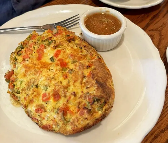 This isn't just an omelet—it's a puffy, golden dome of egg perfection that makes flat omelets everywhere hang their heads in shame.
