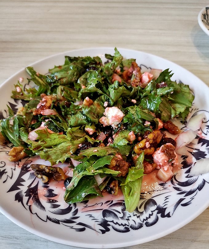 This isn't just salad – it's a garden party where greens, nuts, and feta have gathered to show vegetables can have fun too.