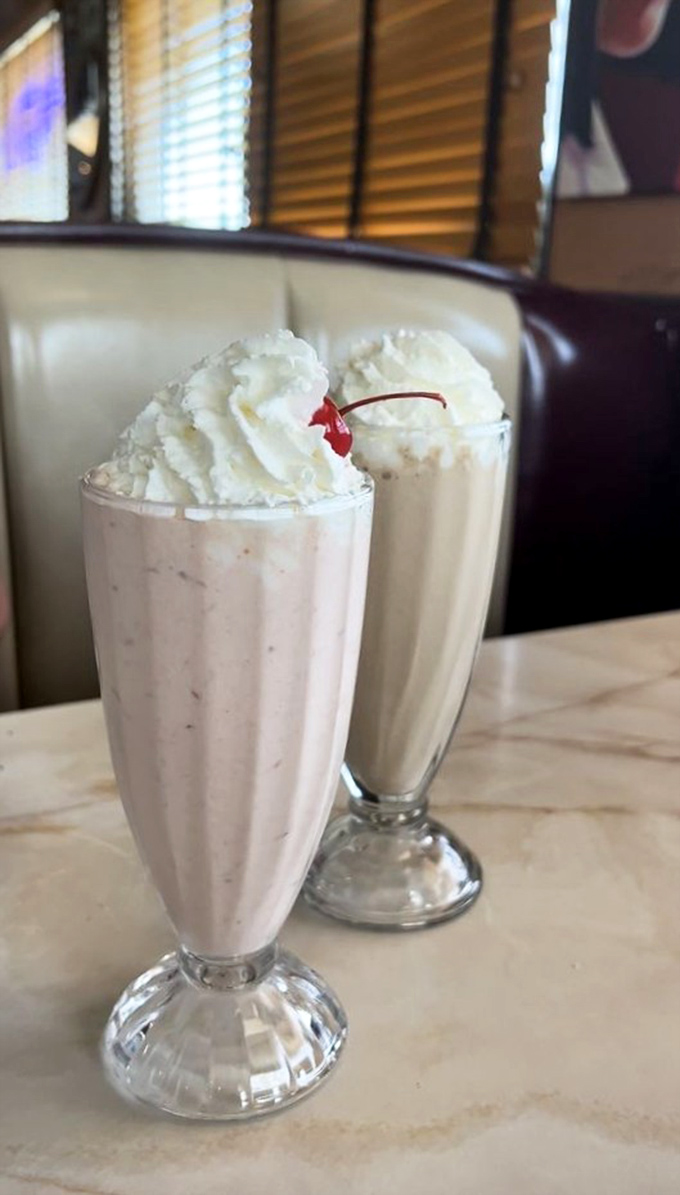 Milkshakes so thick they laugh at your straw. One strawberry, one vanilla—both requiring a moment of silent appreciation before diving in.