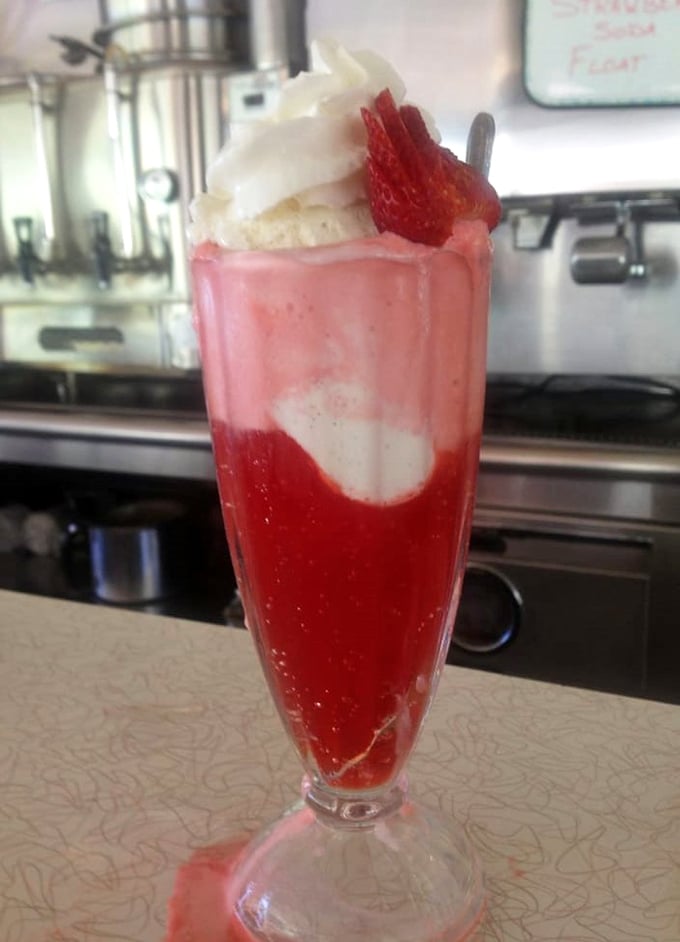 This strawberry soda isn't just a drink—it's dessert in a glass, childhood nostalgia, and Instagram bait all swirled into one tall treat.