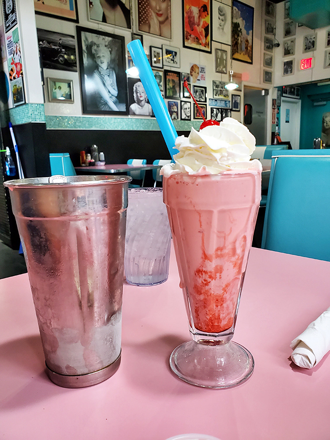 This isn't just a milkshake—it's a pink-hued time machine that transports you straight back to sock hops and soda jerks.