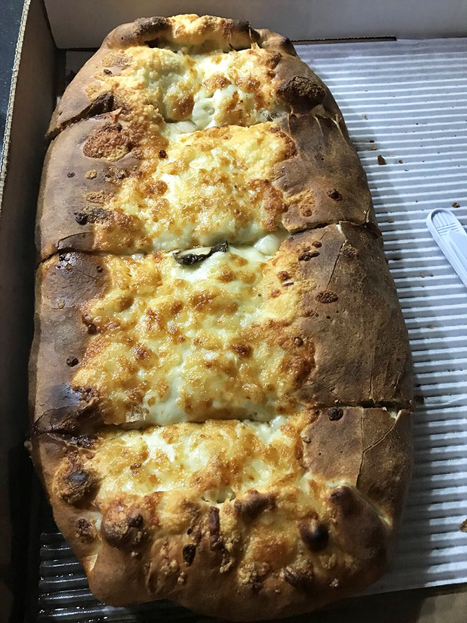 This stromboli isn't just food—it's a cheese-filled love letter to Italian-American cuisine, folded and baked to golden perfection.