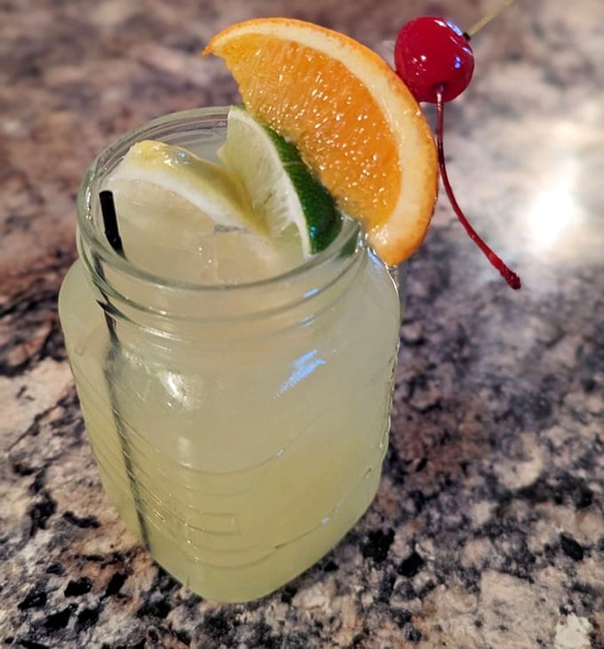 A mason jar cocktail that captures Florida sunshine in liquid form—complete with enough fruit to count as a serving of produce.