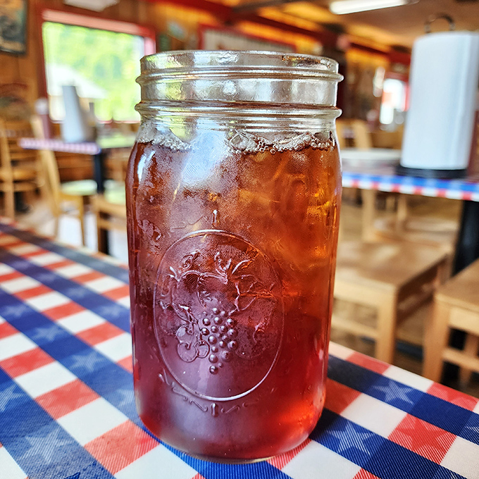 Sweet tea served in a mason jar isn't just a drink—it's a cultural institution. This amber elixir, cold enough to sweat, is the unofficial champagne of the South.