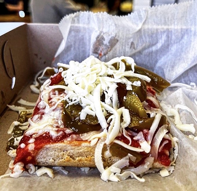 Sweet peppers dancing on cheese like they're auditioning for a pizza commercial from heaven.