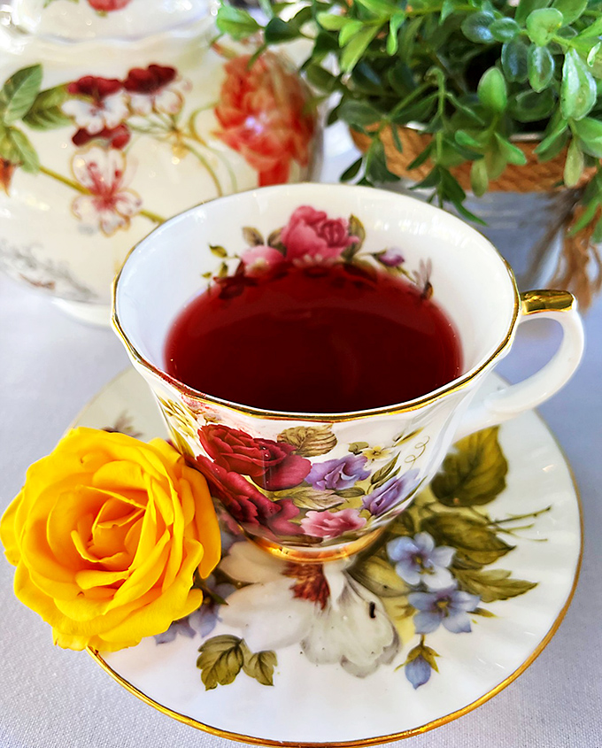 Tea served with the respect it deserves. That yellow rose isn't just decoration—it's setting the stage for a proper moment of pause.