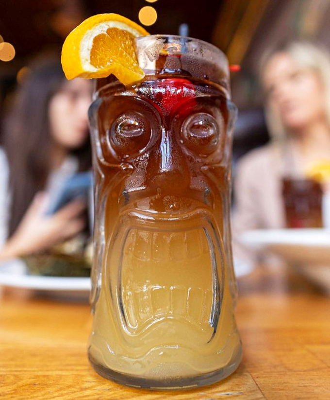 The legendary Navy Grog arrives in a tiki face mug that stares back at you, as if to say, "Yes, I'm strong enough to make you text your ex."