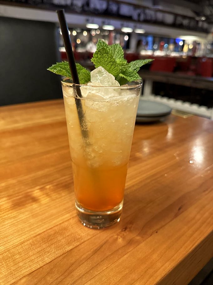 This isn't just a cocktail—it's a refreshing escape from the Arizona heat, complete with mint leaves standing guard.
