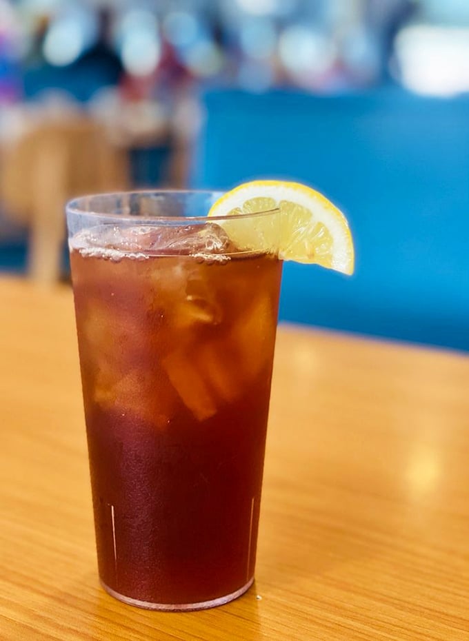 Even the iced tea looks refreshing enough to make you forget you're melting in Florida heat. That lemon slice isn't just garnish—it's necessity.