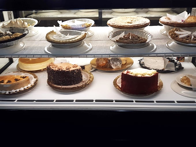 The dessert case—where willpower goes to die and diet plans are cheerfully abandoned for slices of heaven on a plate.