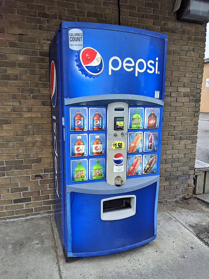 Even the Pepsi machine outside knows its role in the ecosystem—providing the perfect sweet-cutting companion to donut indulgence.