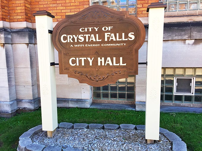 This isn't just a city hall sign—it's the official welcome to a community where your neighbor's business is everyone's business, for better or worse.