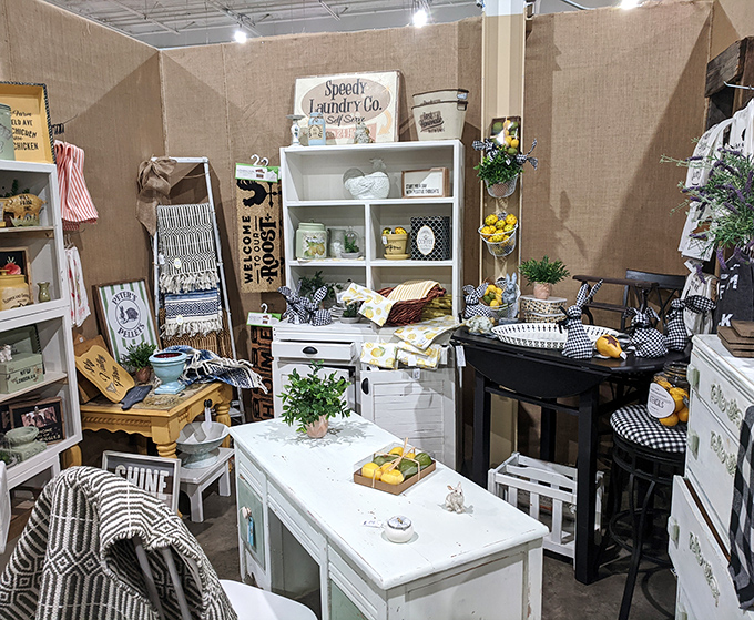 Farmhouse chic before it was trendy—this booth's crisp whites and rustic touches would make any HGTV host reach for their wallet.