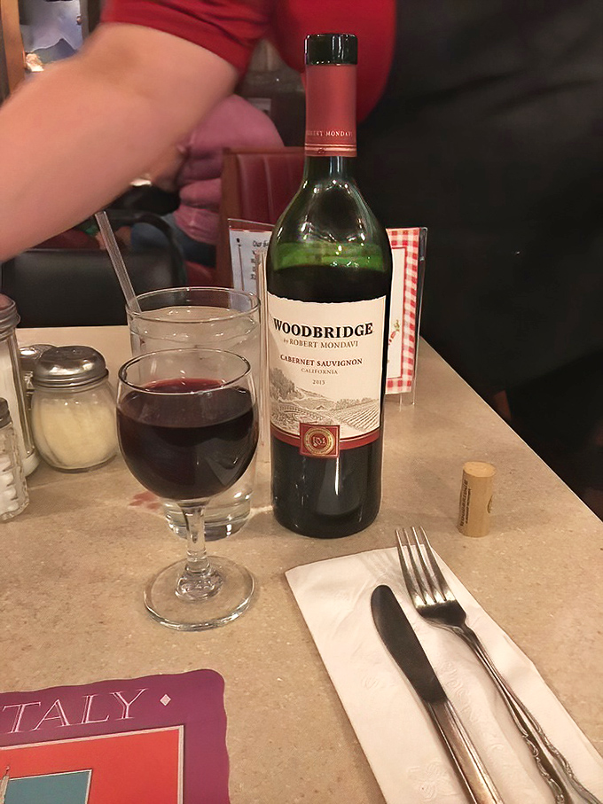 A glass of red wine, checkered tablecloths, and the anticipation of what's to come – some moments are worth savoring slowly.