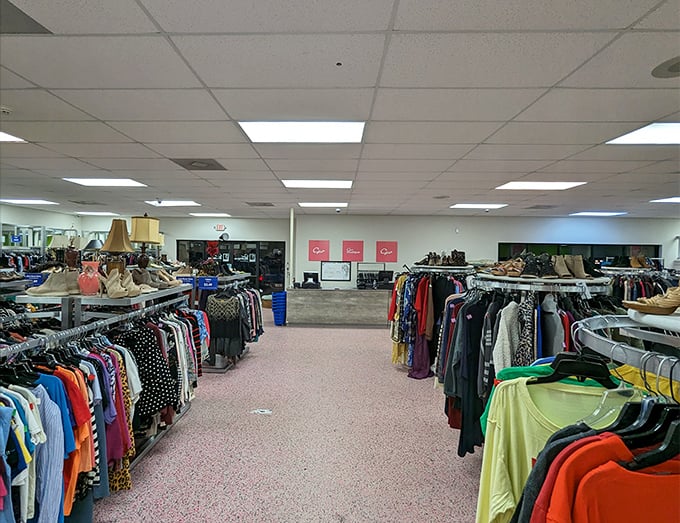 The women's section stretches toward the horizon. Like archaeological layers, each rack reveals fashion epochs from different eras.