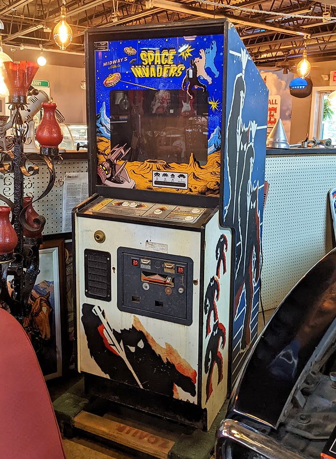 Space Invaders arcade cabinet—where Gen X nostalgia meets collectible art, and quarters once disappeared faster than allowances.