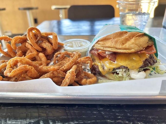 When bacon meets burger, magic happens—especially when that magic includes perfectly melted cheese and a toasted brioche bun.