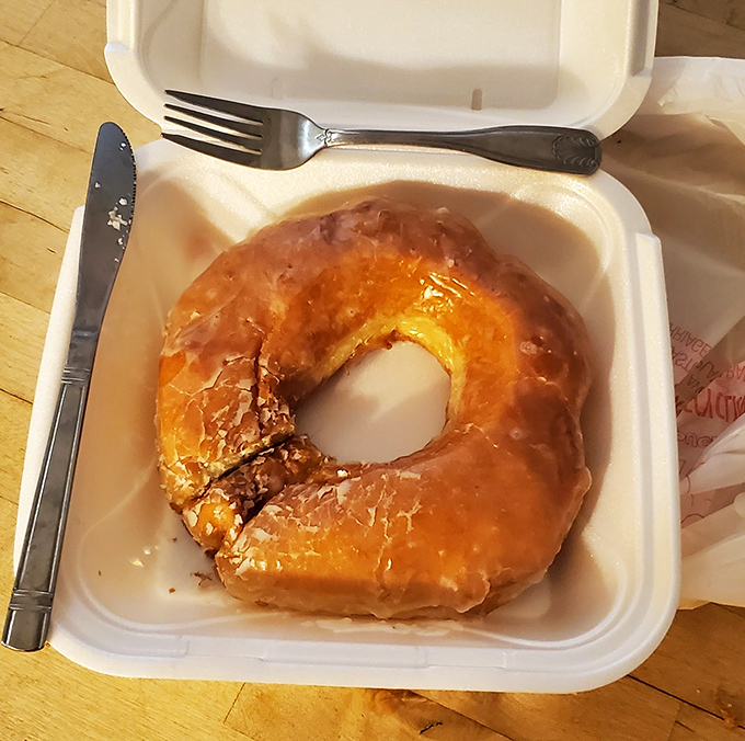 When a donut demands proper cutlery, you know you're dealing with something special. This glazed masterpiece isn't just eaten – it's experienced.