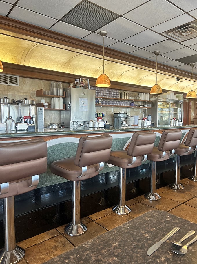 The counter seats offer front-row tickets to the choreographed chaos of diner kitchen magic. Coffee refills come at the speed of thought.