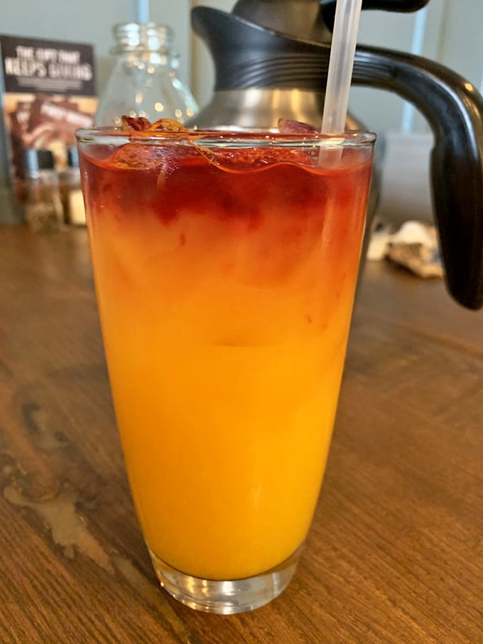 This isn't just orange juice—it's sunshine in a glass with a bacon garnish that's living its best life.