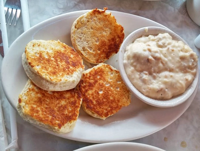 Fluffy biscuits swimming in sausage gravy – the kind of Southern comfort that makes Yankees reconsider everything.