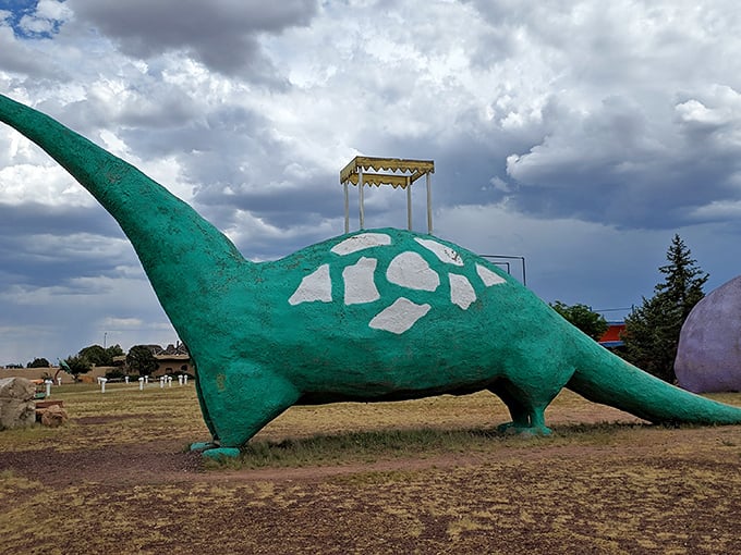 This turquoise brachiosaurus isn't just prehistoric eye candy – climb to the top for a slide that's sure to awaken your inner child.