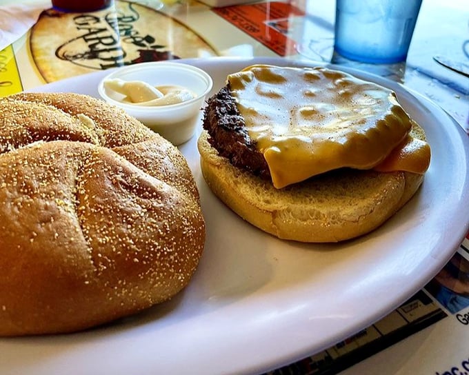 This isn't just a burger—it's architectural perfection between two buns, with those golden fries standing at attention alongside.