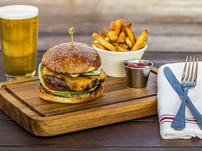 The classic American burger, elevated to first-class status aboard a historic vessel. This isn't fast food—it's a slow, deliberate celebration of beef, cheese, and perfect golden fries.