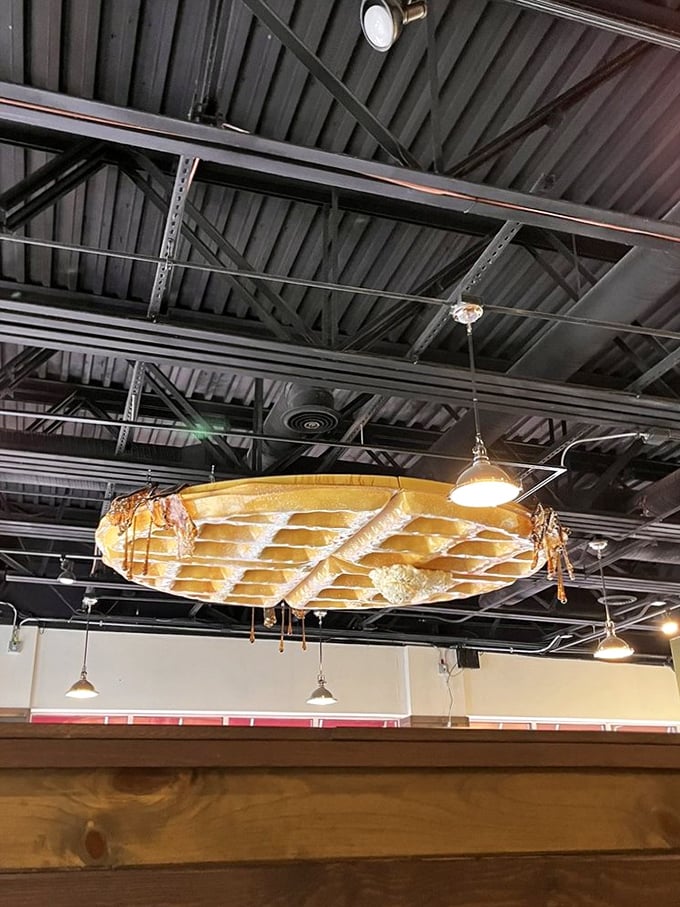 Look up! That giant waffle chandelier isn't just decor—it's a reminder of what brings us all together under this roof: the pursuit of breakfast perfection. 