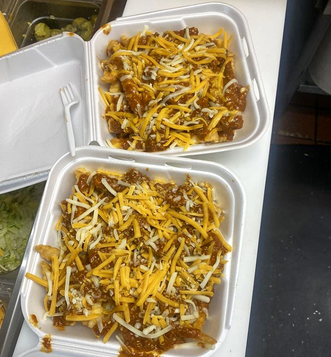 Chili cheese fries that don't mess around. This glorious mess of crispy potatoes, savory chili, and melted cheese demands a fork—or at least extra napkins.