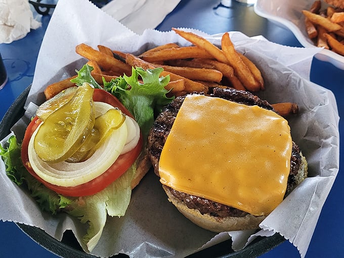 This isn't just a cheeseburger; it's the reason napkins were invented. Notice how the cheese melts just right—that's not an accident, folks.