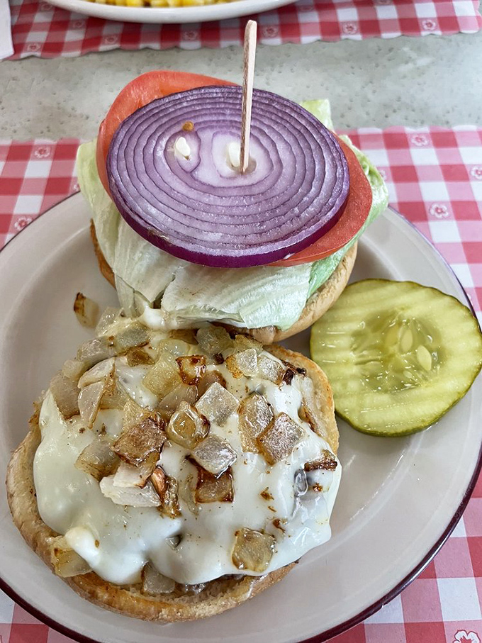 The open-faced burger revelation nobody warned me about! Melted cheese cascading over sautéed onions and mushrooms—a knife-and-fork affair worth the extra napkins.
