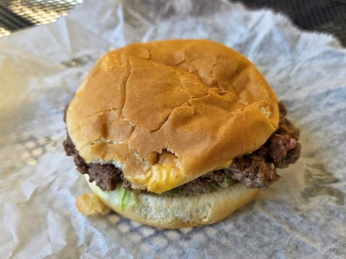Meet the humble cheeseburger that's converted fancy food critics into believers. No truffle aioli or brioche bun needed—just pure, honest burger craftsmanship.