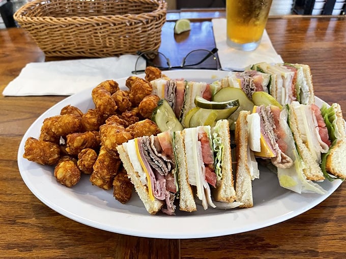 The club sandwich—architecture you can eat, with layers so perfectly balanced they could teach a master class in sandwich engineering.