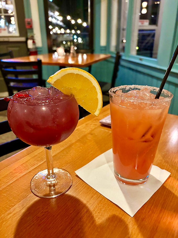 The Orange Crush on the right isn't just a cocktail—it's Maryland's unofficial summer anthem in liquid form, best enjoyed with a sunset view.