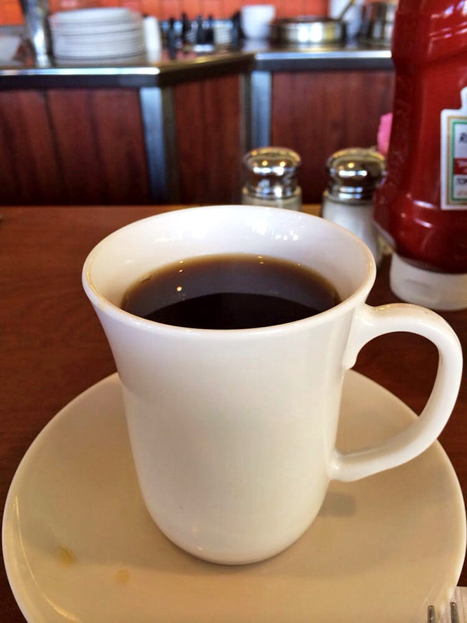 Diner coffee in its natural habitat – a thick white mug that promises endless refills and comfort.