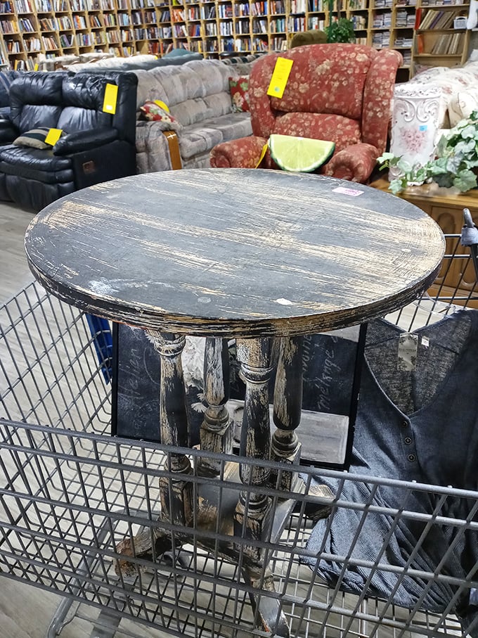 This distressed table has more character than most reality TV stars. Its weathered surface whispers of family dinners and board game battles from decades past.