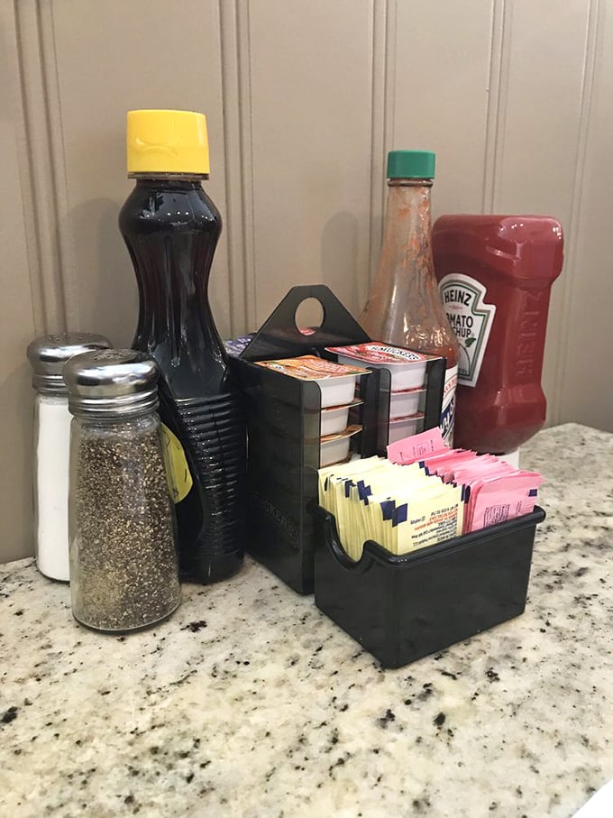The condiment station – breakfast's supporting cast ready for their moment to shine. That syrup bottle has seen things, man.