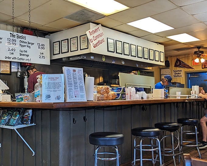 The command center where burger dreams become reality. Those framed accolades aren't just decoration—they're well-earned battle medals.