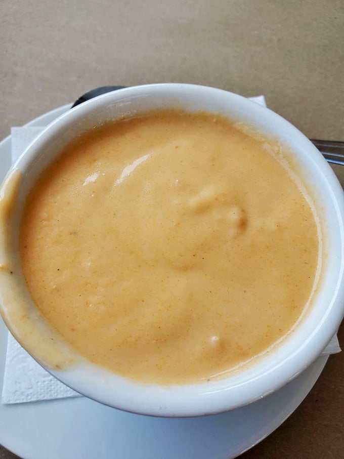 This lobster bisque isn't just soup—it's liquid velvet with seafood essence, the kind that makes you contemplate drinking from the bowl.